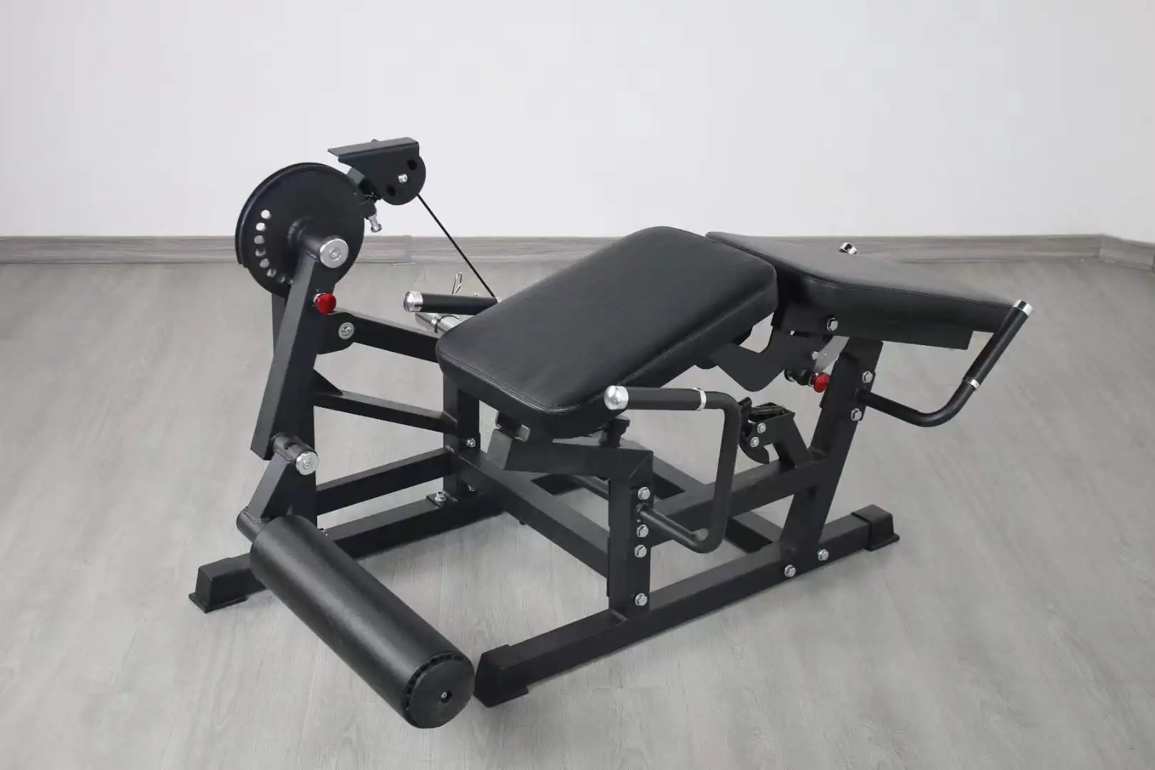 Plate Loaded Seated Leg Extension Trainer And Prone Leg Curl Workout ...