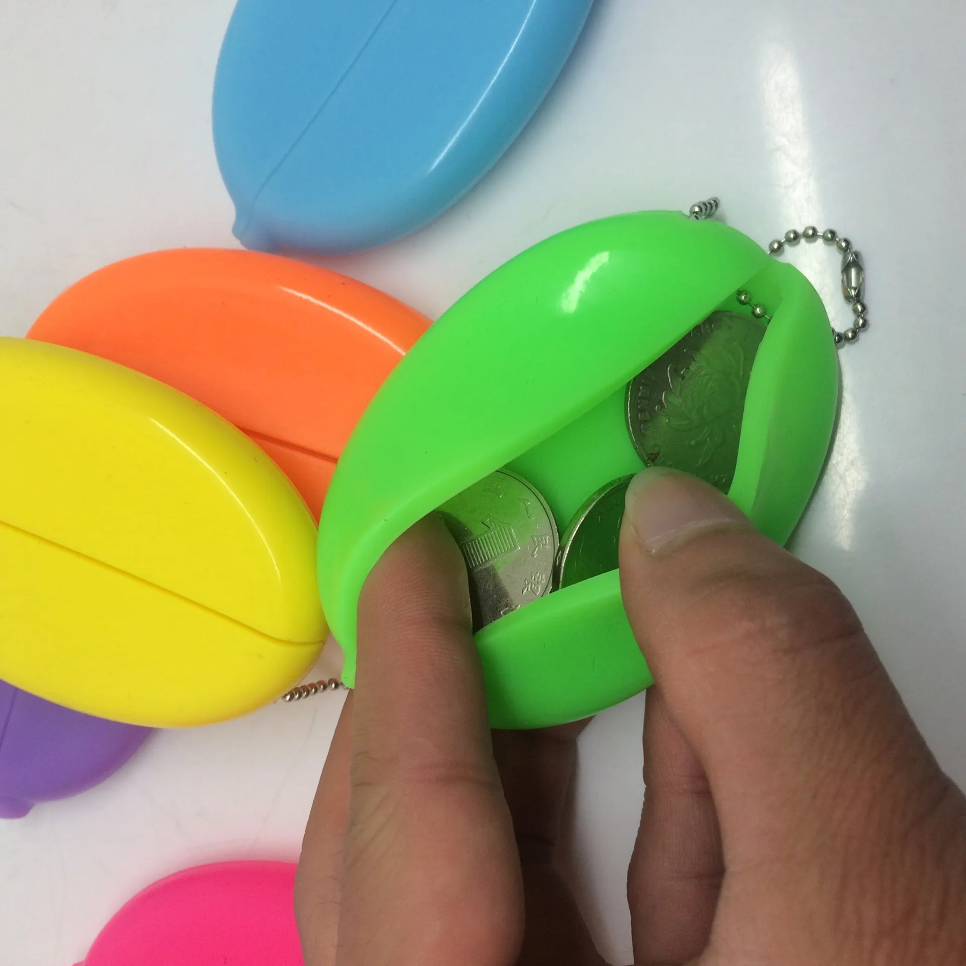 Eco-friendly Logo Customized Rubber Coin Holder Squeeze Keychain Coin ...