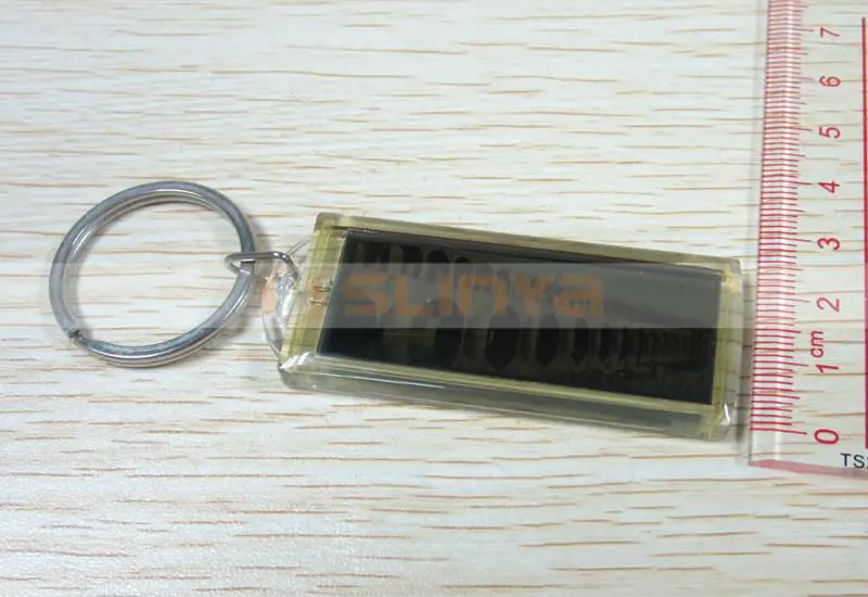 Solar-Powered Flashing Light Keychain - Customizable OEM | Wholesale