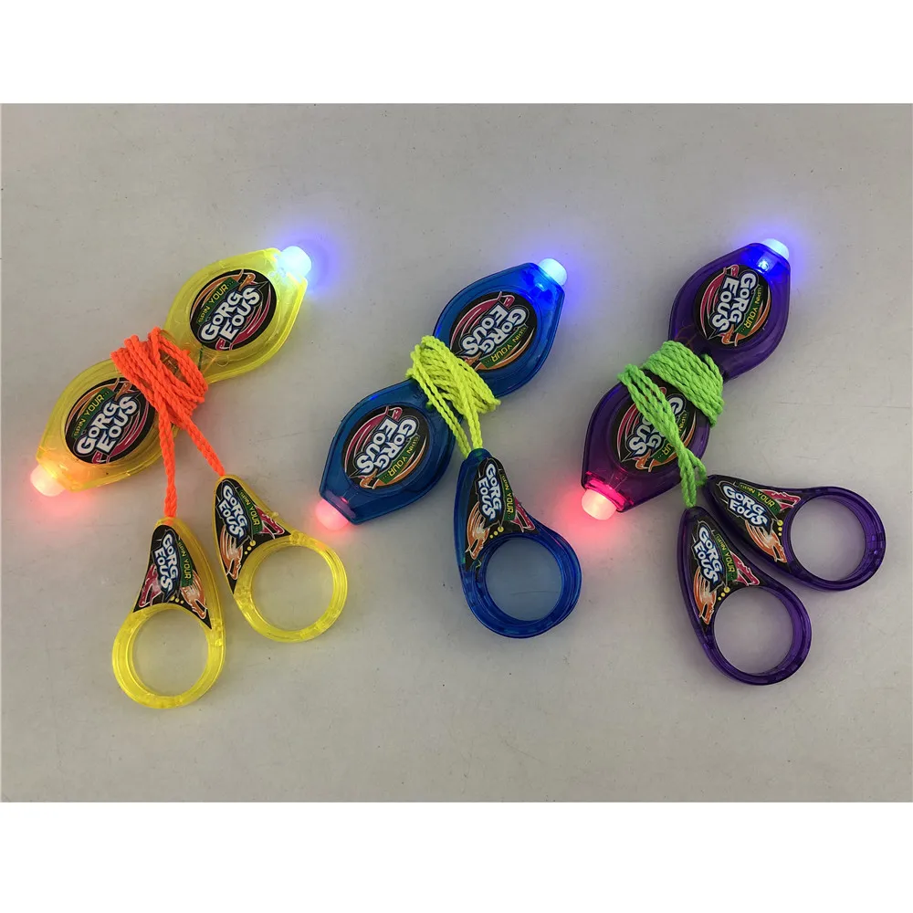 Magic Laser Pull a String Spinner - Fun and Whistle Toy