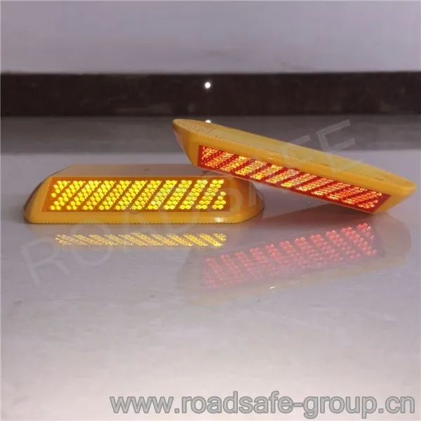 Enhance Pedestrian Safety with Red Reflectors on Road