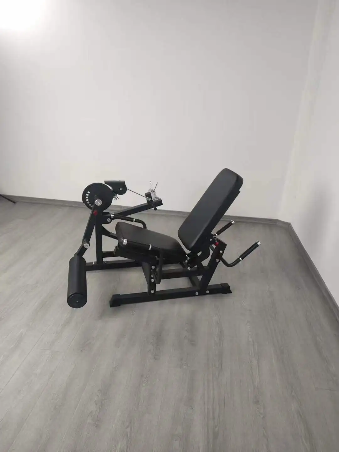 Plate Loaded Seated Leg Extension Trainer And Prone Leg Curl Workout ...
